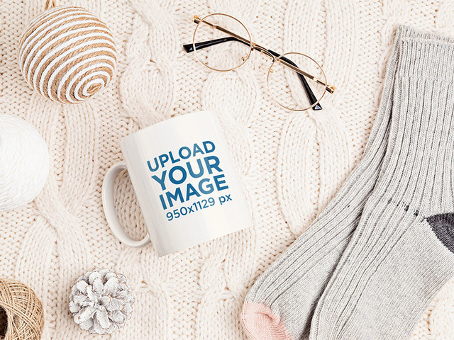 Placeit - 11 oz Coffee Mug Mockup Featuring Knitted Garments