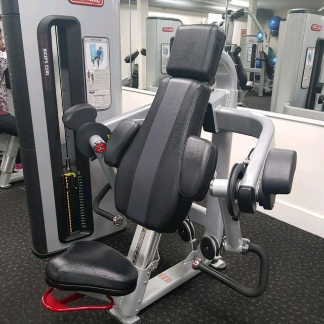 Seated Machine Bicep Curls by Daniel Arixi - Exercise How-to - Skimble