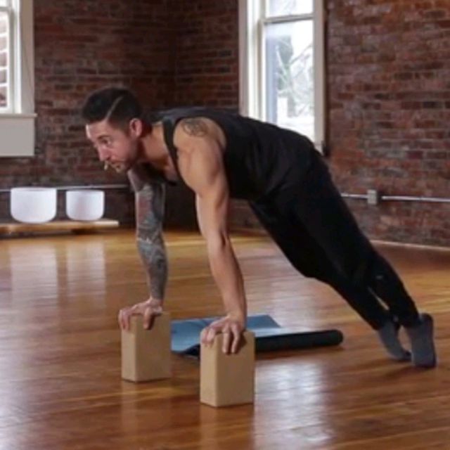 Sliding From Plank With Hands On Blocks To Draw Knees Into Chest ...