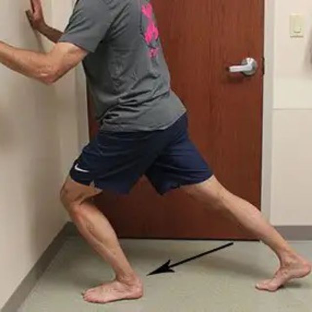 Wall Press Achilles Stretch - Exercise How-to - Workout Trainer by Skimble