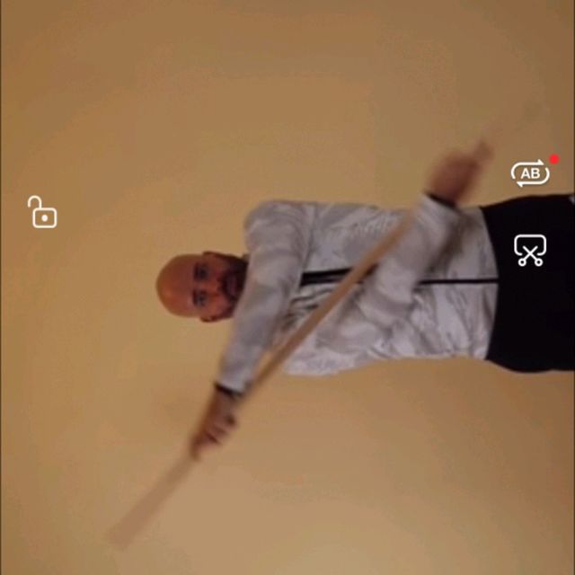 Stick Rotation Back Strech by Chan Y. - Exercise How-to - Skimble