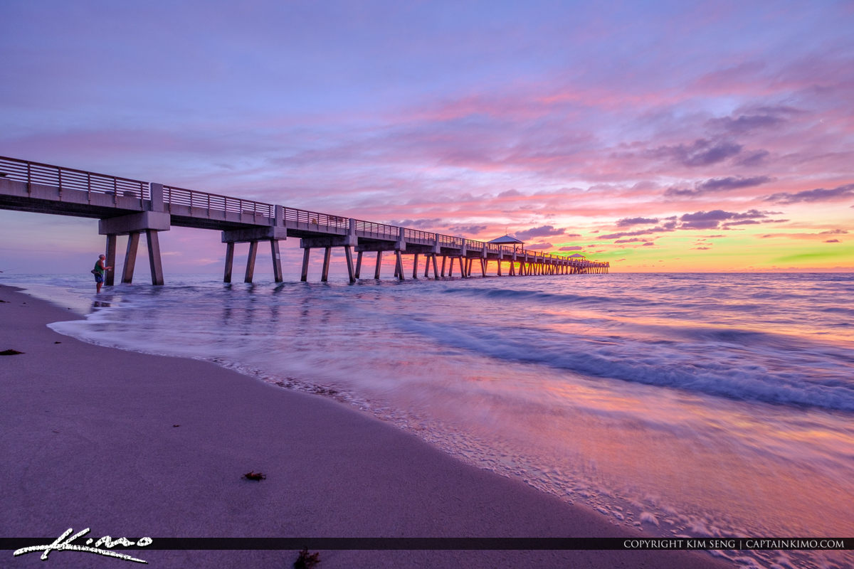 Juno Beach Pier Along the Beach During Sunrise | Royal Stock Photo