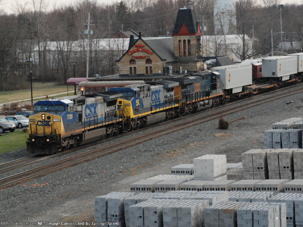 A trio of CSX units power a trailer train east.