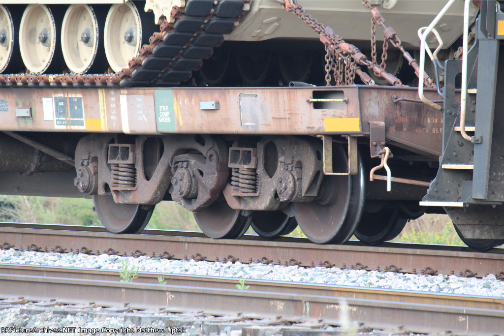 Close up of extra-heavy duty 3-axle trucks