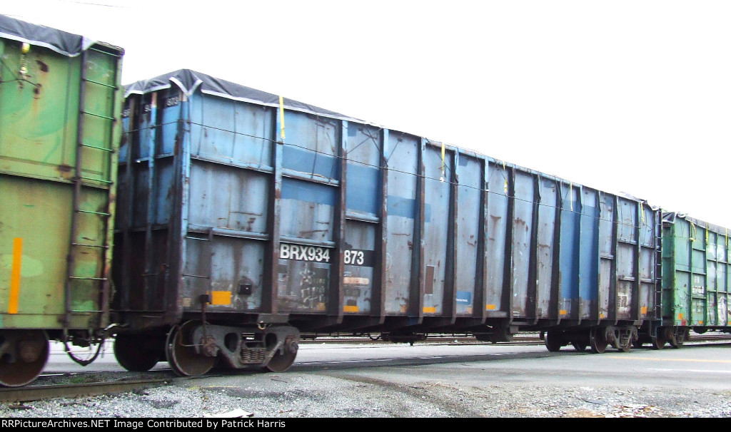 GBRX 934873 X-GN wood chip gondola with mesh screening atop northbound ...