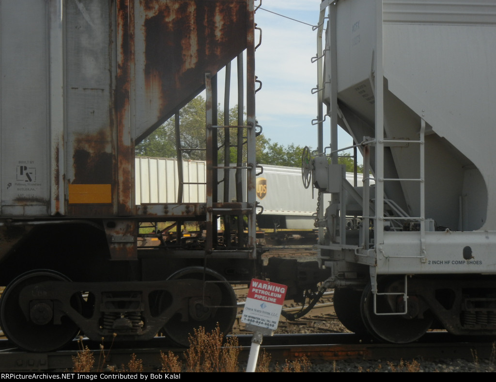 looking thru CSX 9002 & RCPE 6400 southound train at northwest bound ...