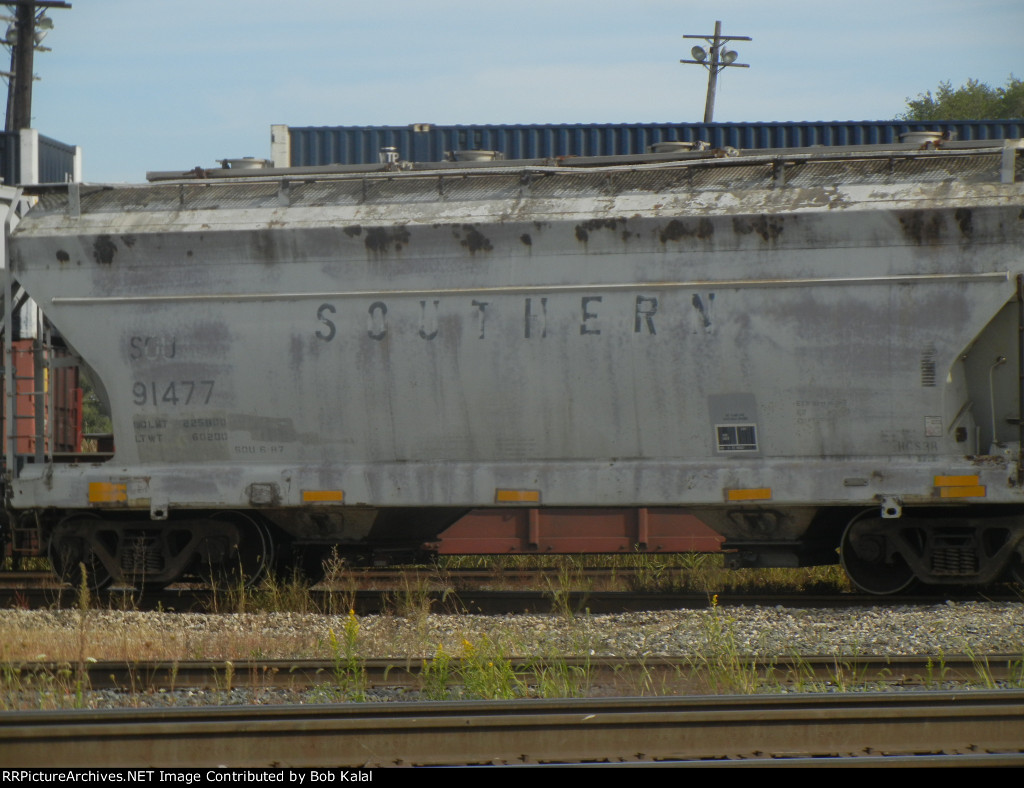 Southern hopper in the CSX 9002 & RCPE 6400 southbound train