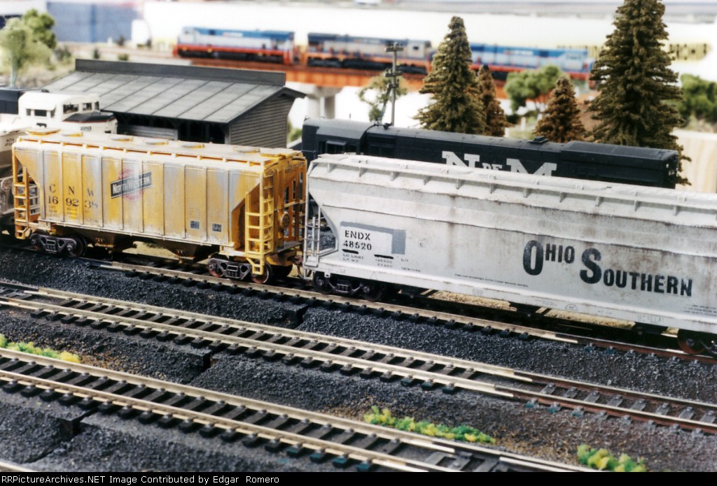 Two covered hoppers (a CNW 100 ton, and an ex OS ACF),