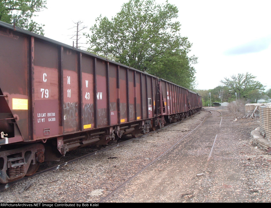 ex Rock Island hoppers filled with roadbed rock