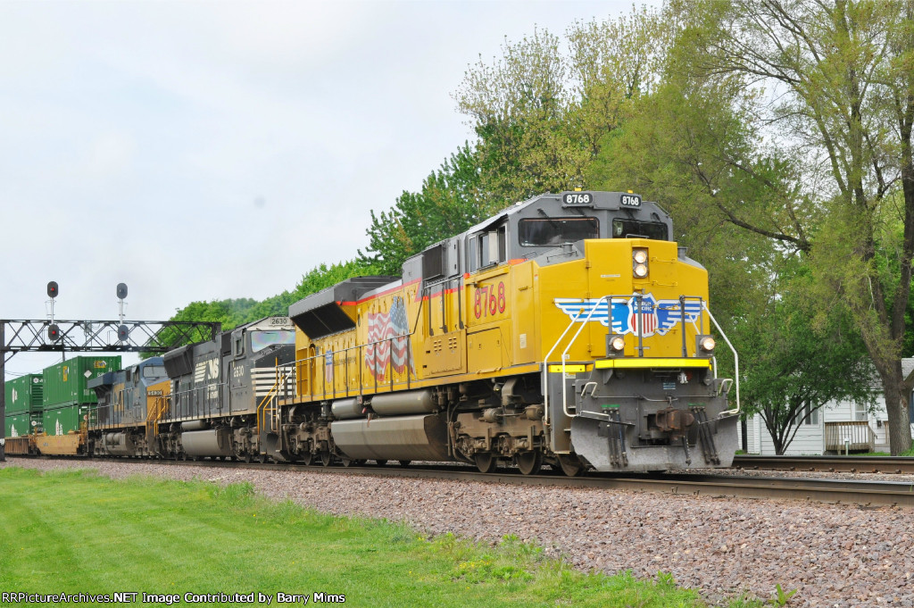 UP 8768 East leads a NS and CSX engine