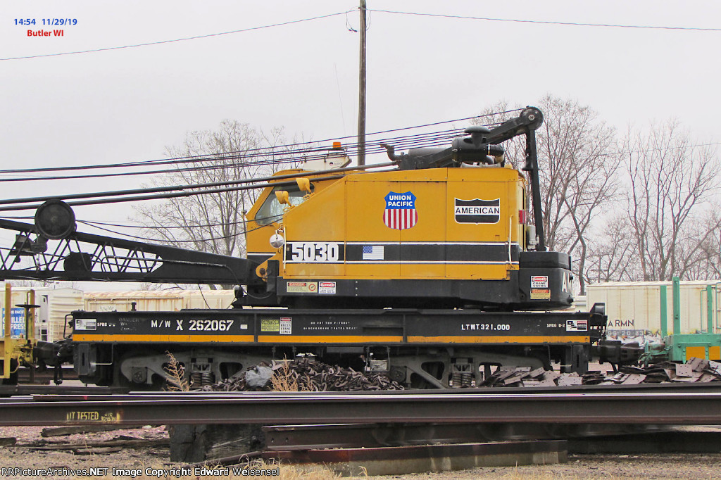 American locomotive crane is teamed with OLS caboose CNW 261531