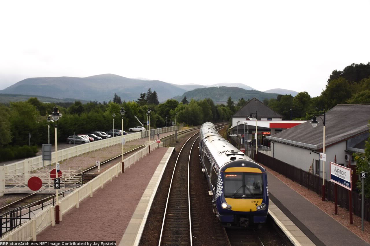 A Class 170 DMU arrives from the south