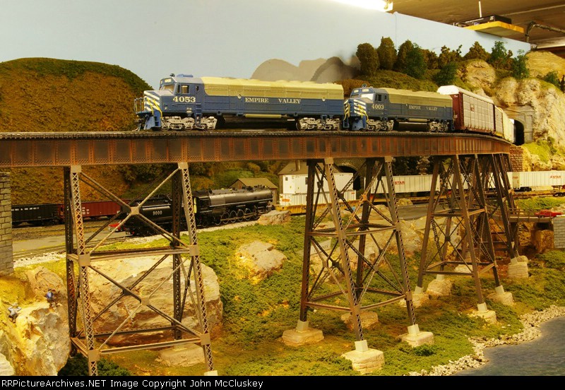 EV EMD cowl units hustle autoracks across Bill's Bridge