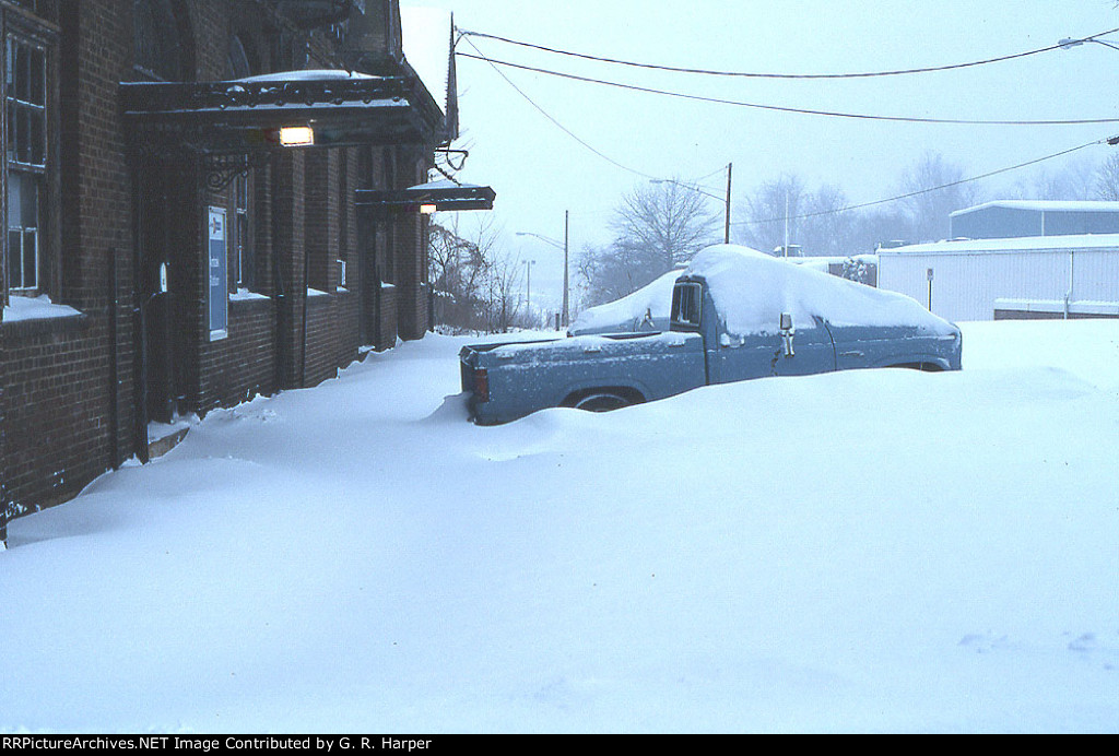 Snow piled high in front of Kemper St. Station