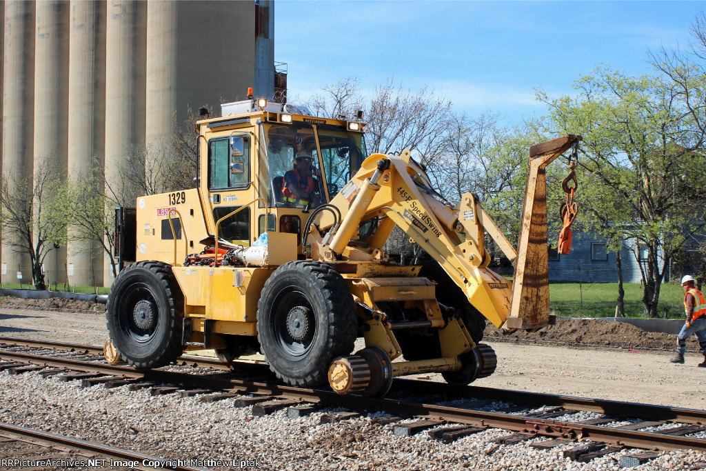 A rail lifter heads east