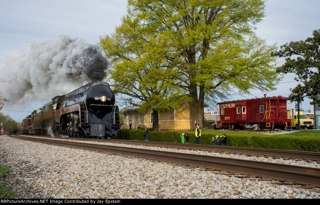 611 passes the old depot and Southern RY caboose