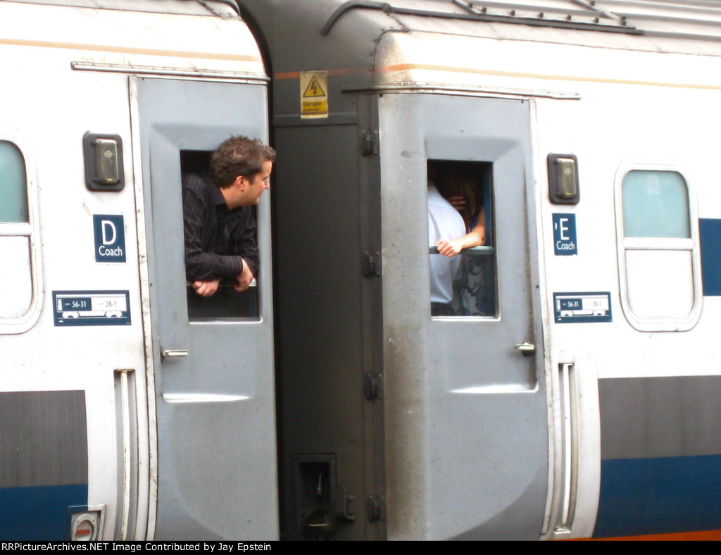 People lean out of the window during the stop at Leicester