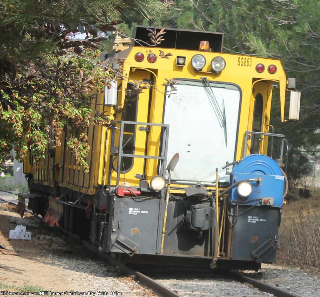 Rear view of Rail Works rail grinder. Lean is due to condition of track!