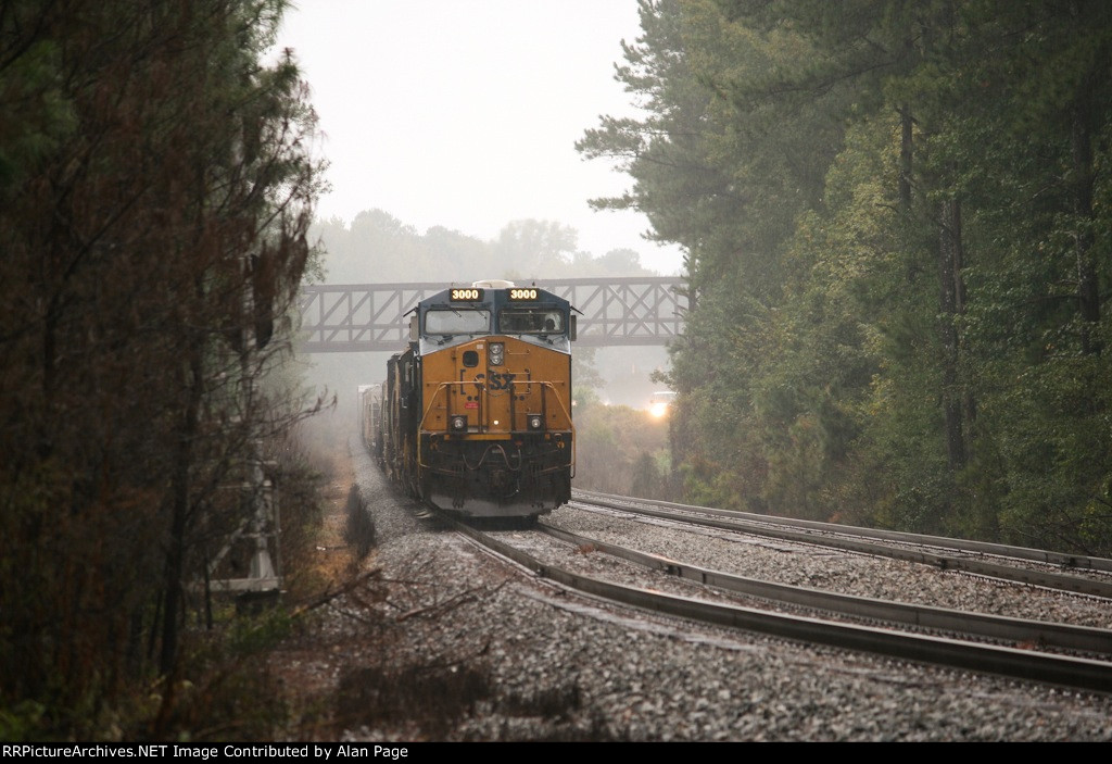 CSX ES44AC-H 3000 holds with mixed freight in the rain