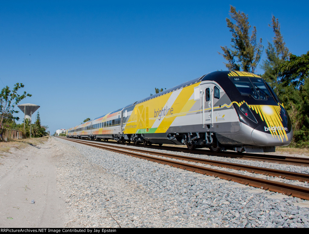 Brightline 101 brings up the rear of a northbound train