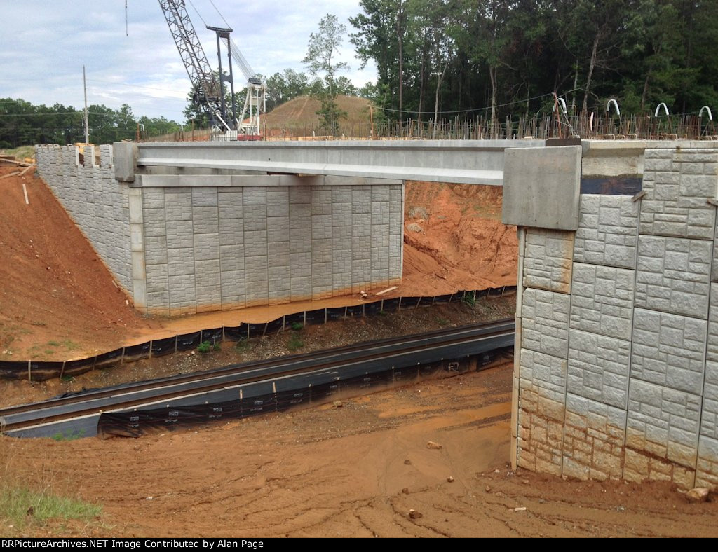 Work continues on the overpass cross beams at the overpass construction ...