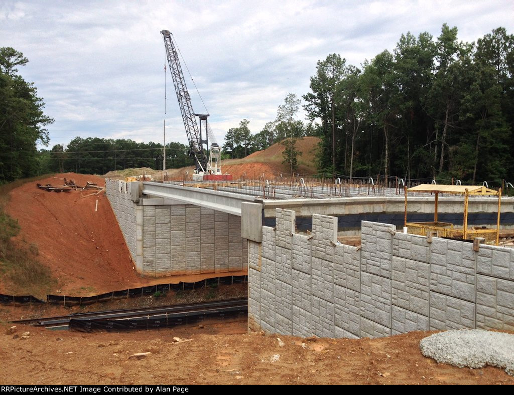 Work continues on the overpass cross beams at the McDuff Parkway ...