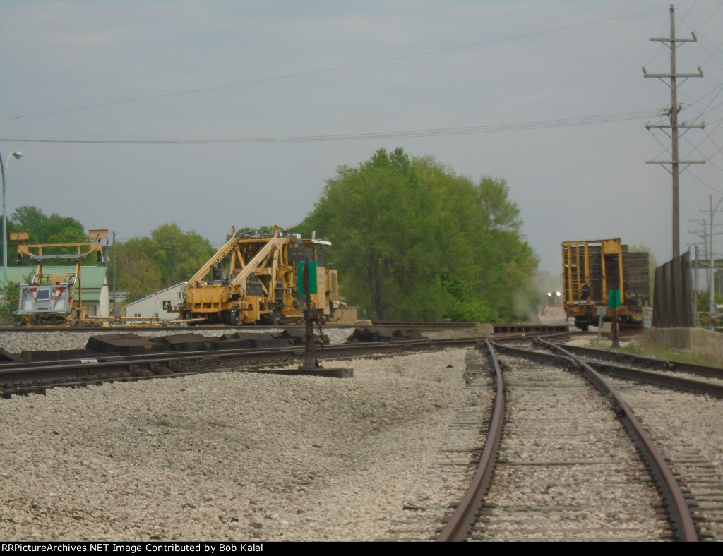 Looking East at the Track Equipment replacing & setting New Concrete Ties