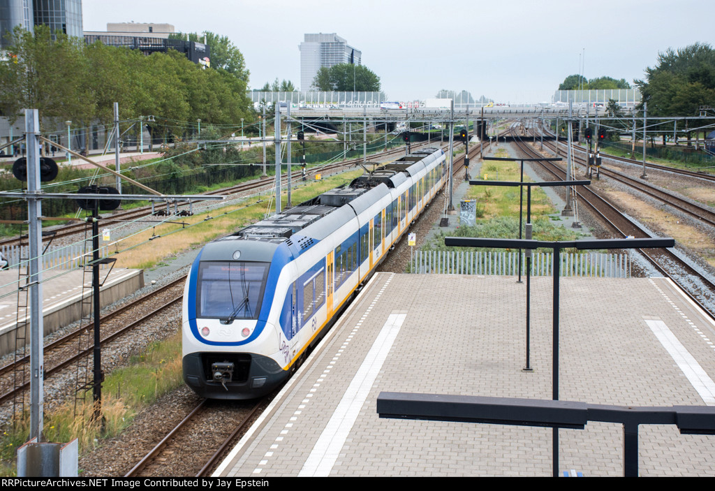 A Sprinter services departs the lower level of Amsterdam Sloterdijk