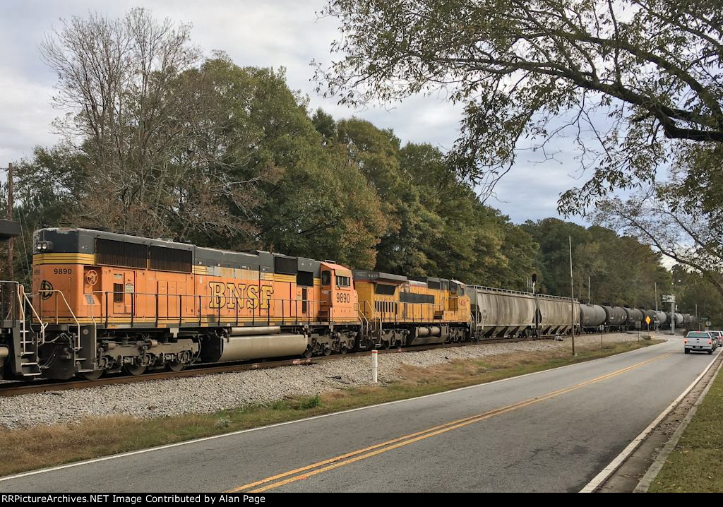 BNSF 9890 and GECX 9406 pause for green