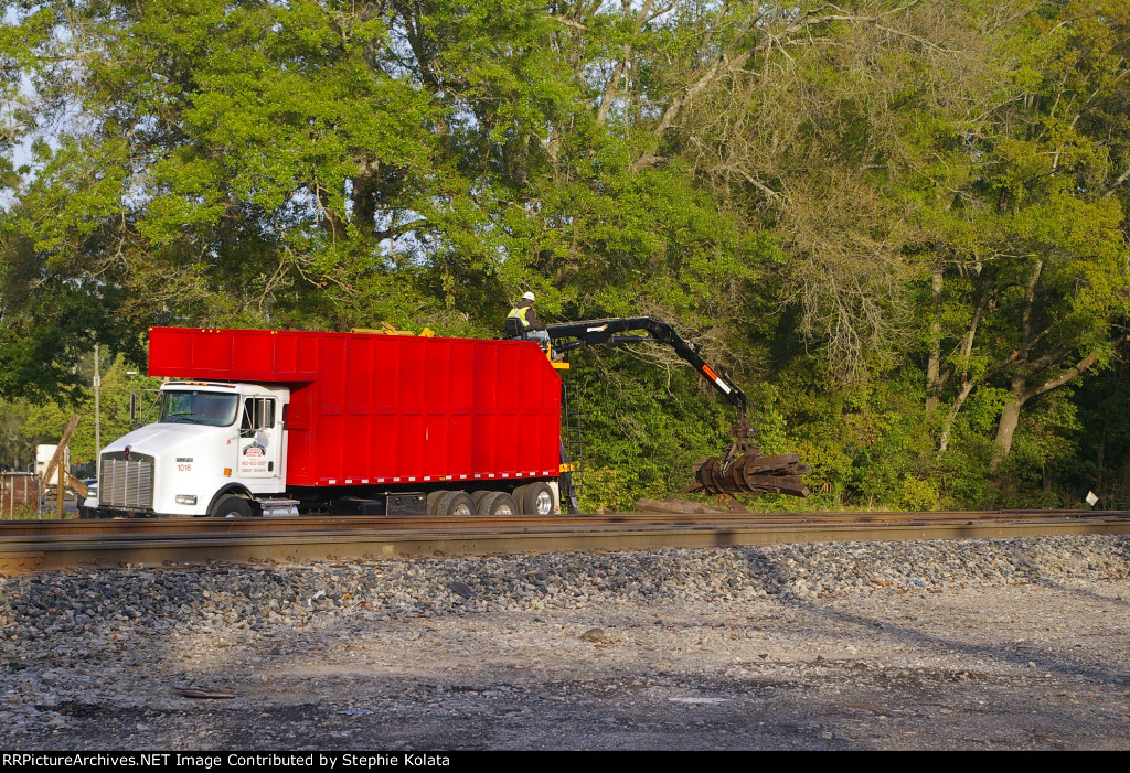 NS CONTRACTOR REACHING FOR OLD TIES