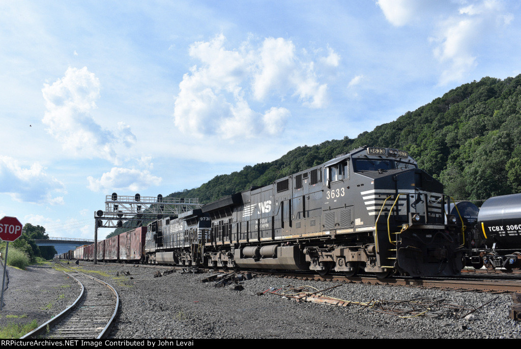Eastbound NS Train passing underneath a nearly extinct PRR signal ...