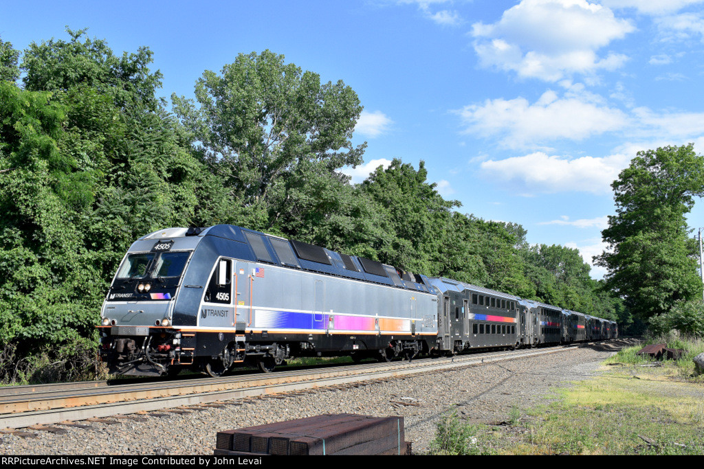 A ALP45DP leads a multilevel set into Ramsey Main St Station running at ...