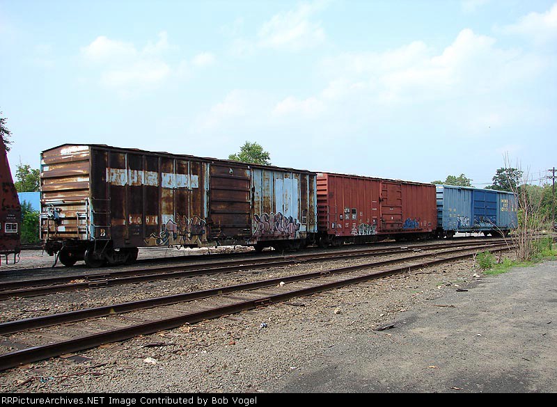 three box cars at team track