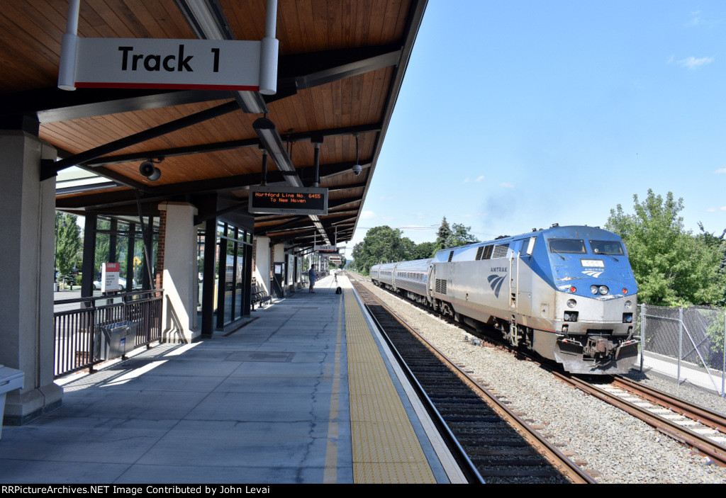 Amtrak P42 # 111 pushes Shuttle Train # 464 out of Wallingford Station ...