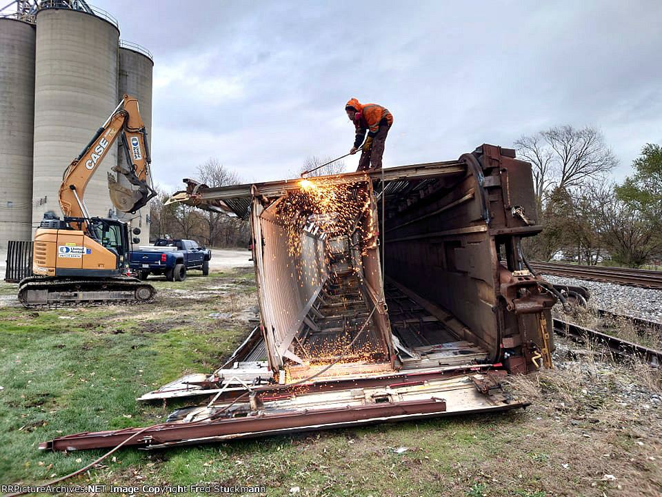 Piece by piece the auto rack succumbs to the torch.