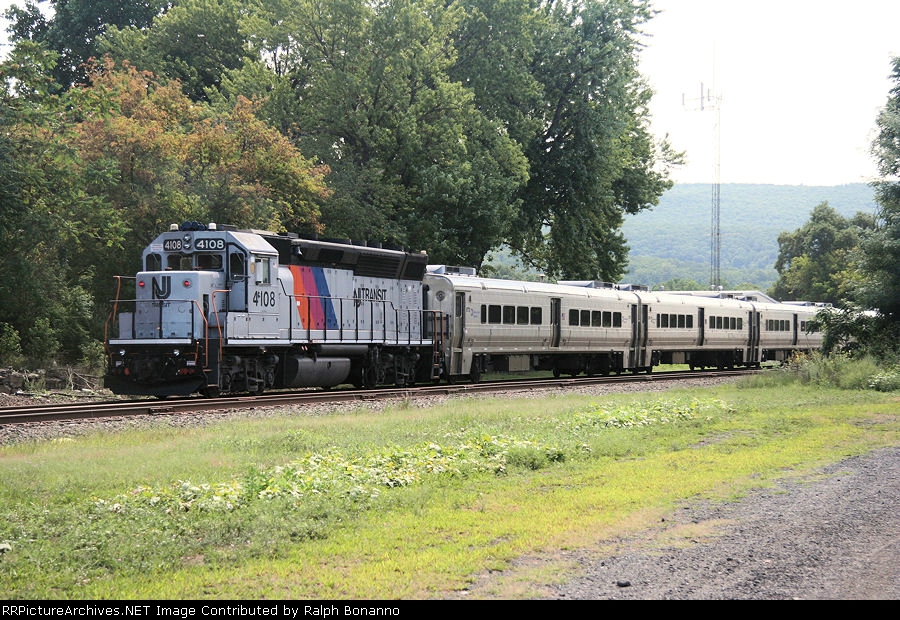 NJT 4108 shoves an eastbound mid day local to Hoboken out of town
