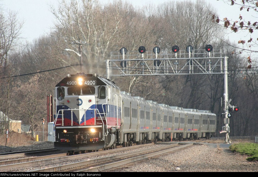 MTA owned 4900 leads an all comet V consist westward towards Port ...