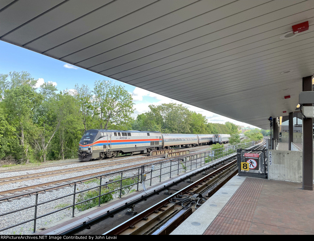 Amtrak Train # 89, with P42 # 130 in the Phase II colors approaches the ...