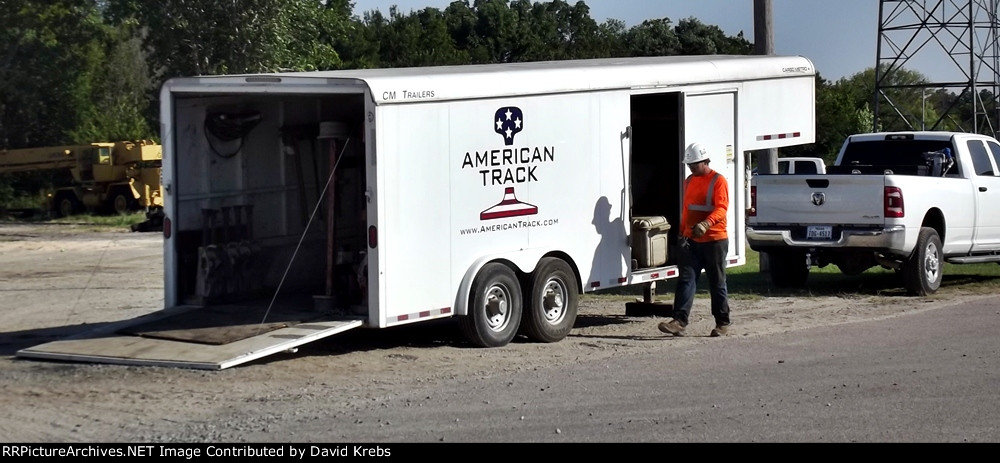American Track company trailer and worker.