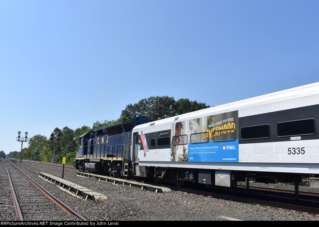 I see an engine with Ex-CNJ colors pushing NJT Train # 5520 out of the ...