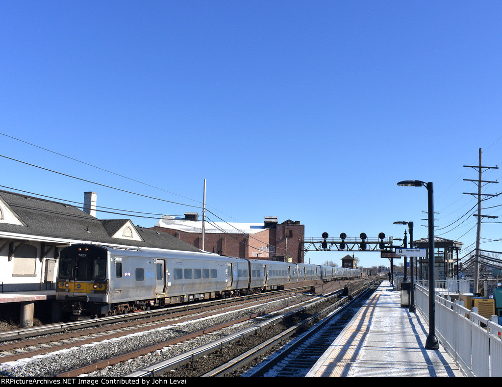 LIRR M7 Car # 3823 leading a westbound into Queens Village Station