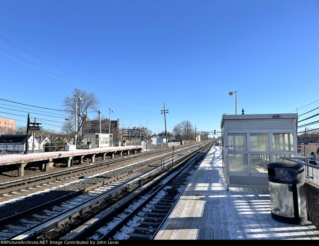 Hollis Station-looking east. There are bus stop style shelters on both ...