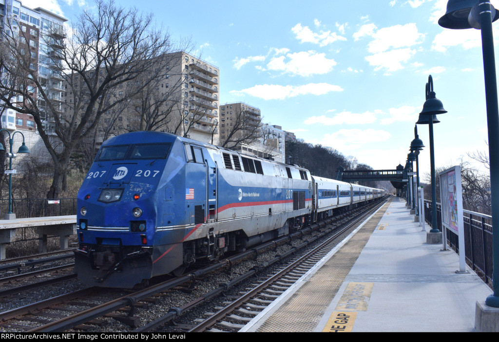 MNR P32AC-DM # 207 pushing the eastbound past Greystone Station