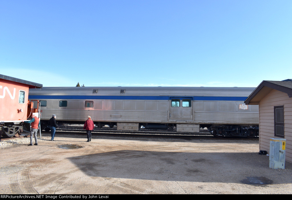 People enjoying fresh air at the Canora Depot with the VIA Rail Budd ...