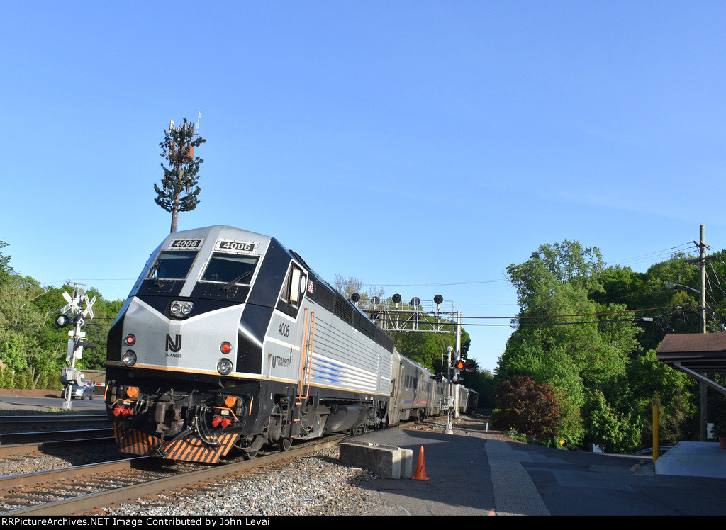 Train # 1126, being pushed by a PL42AC, is about to slow down for its ...