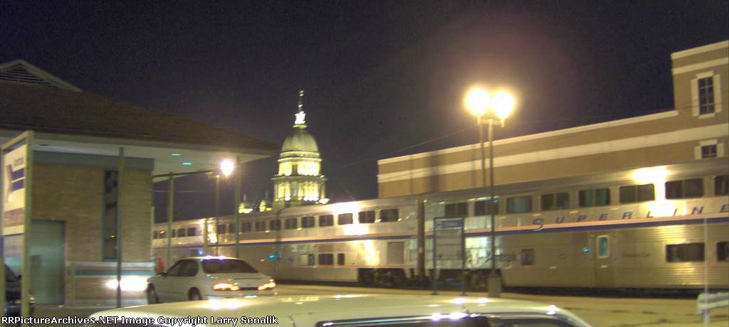 Amtrak at night, Springfield Il with the state capitol in the background