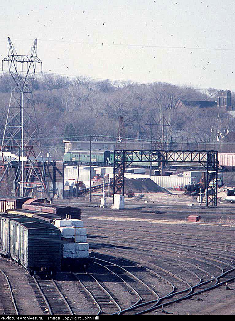 1042-20 Westbound BN freight seen on ex-NP main in background while ...