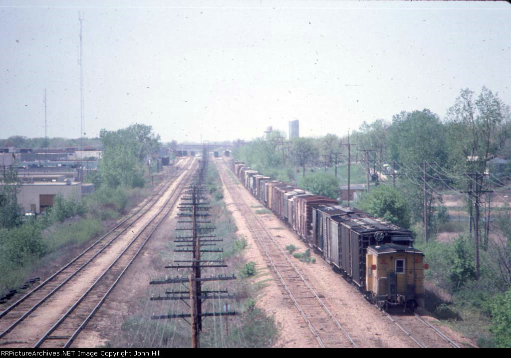 1050-19 Westbound C&NW freight seen from overhead MN&S bridge