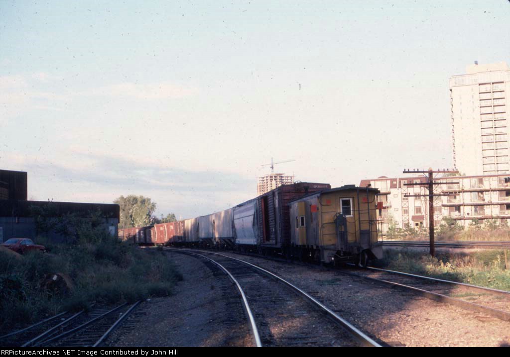 1084-37 Eastbound CNW freight passing Elevator Yard near France Ave