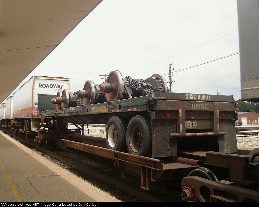 Traction Motors on trailer on Flatcar